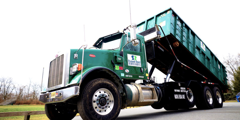 roll off dumpster truck - Russell Reid